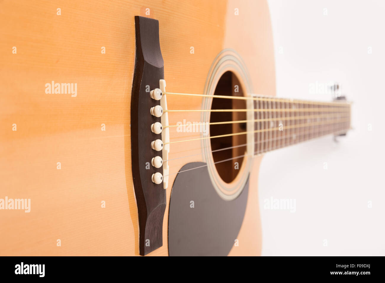 Electric acoustic yellow guitar close up isolated on white background ...