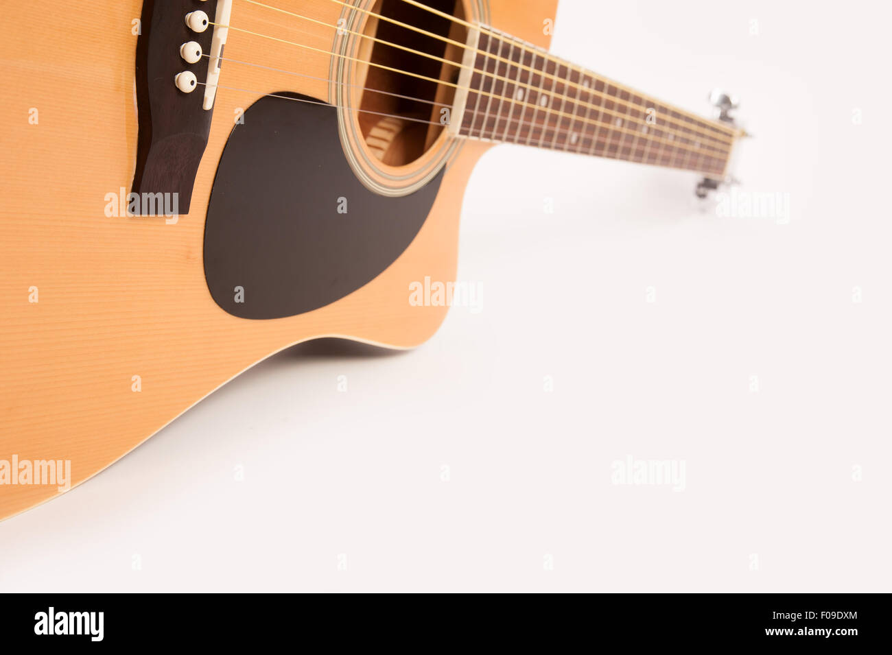 Electric acoustic yellow guitar close up isolated on white background ...