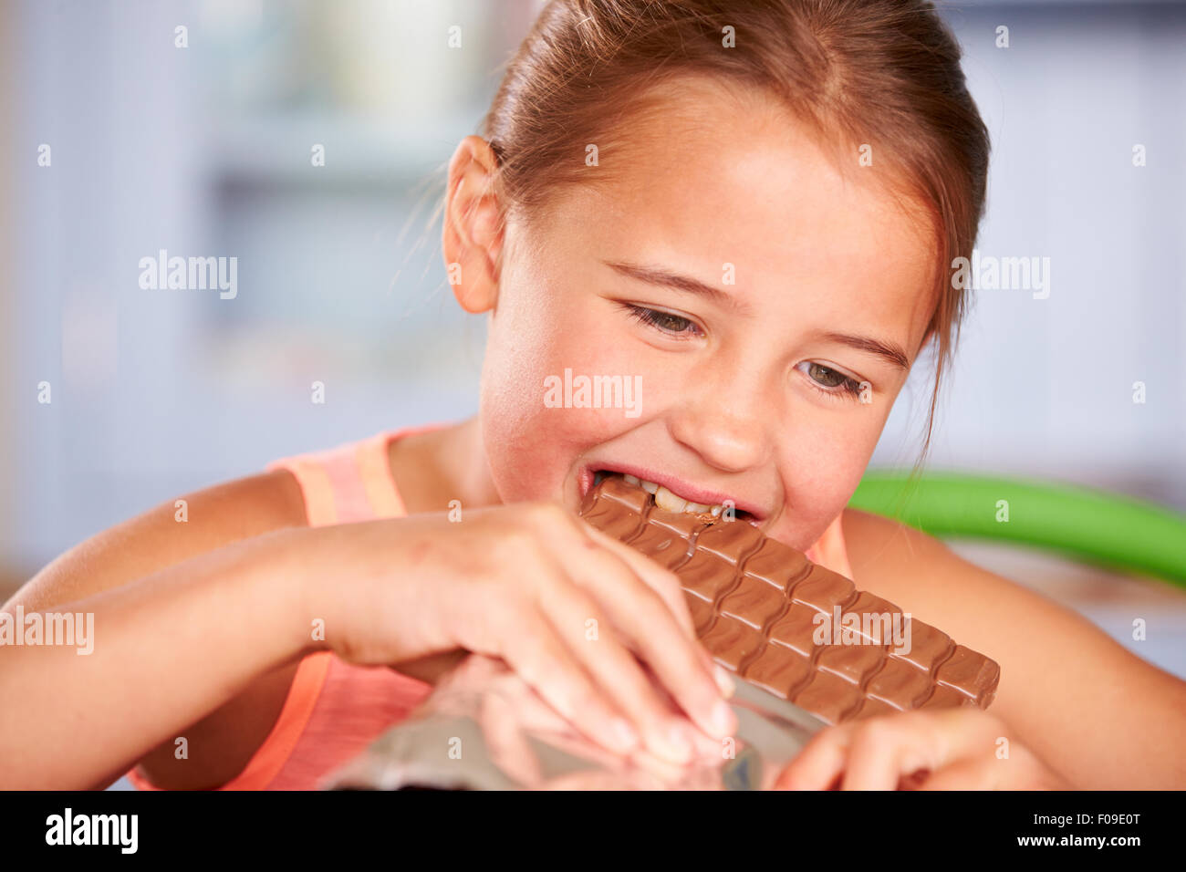 Close Up Of Girl Eating Bar Of Chocolate Stock Photo - Alamy