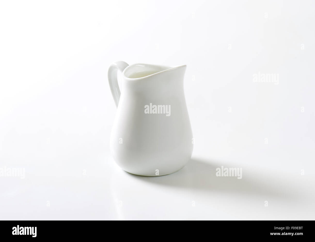 Fresh milk in white pitcher Stock Photo - Alamy