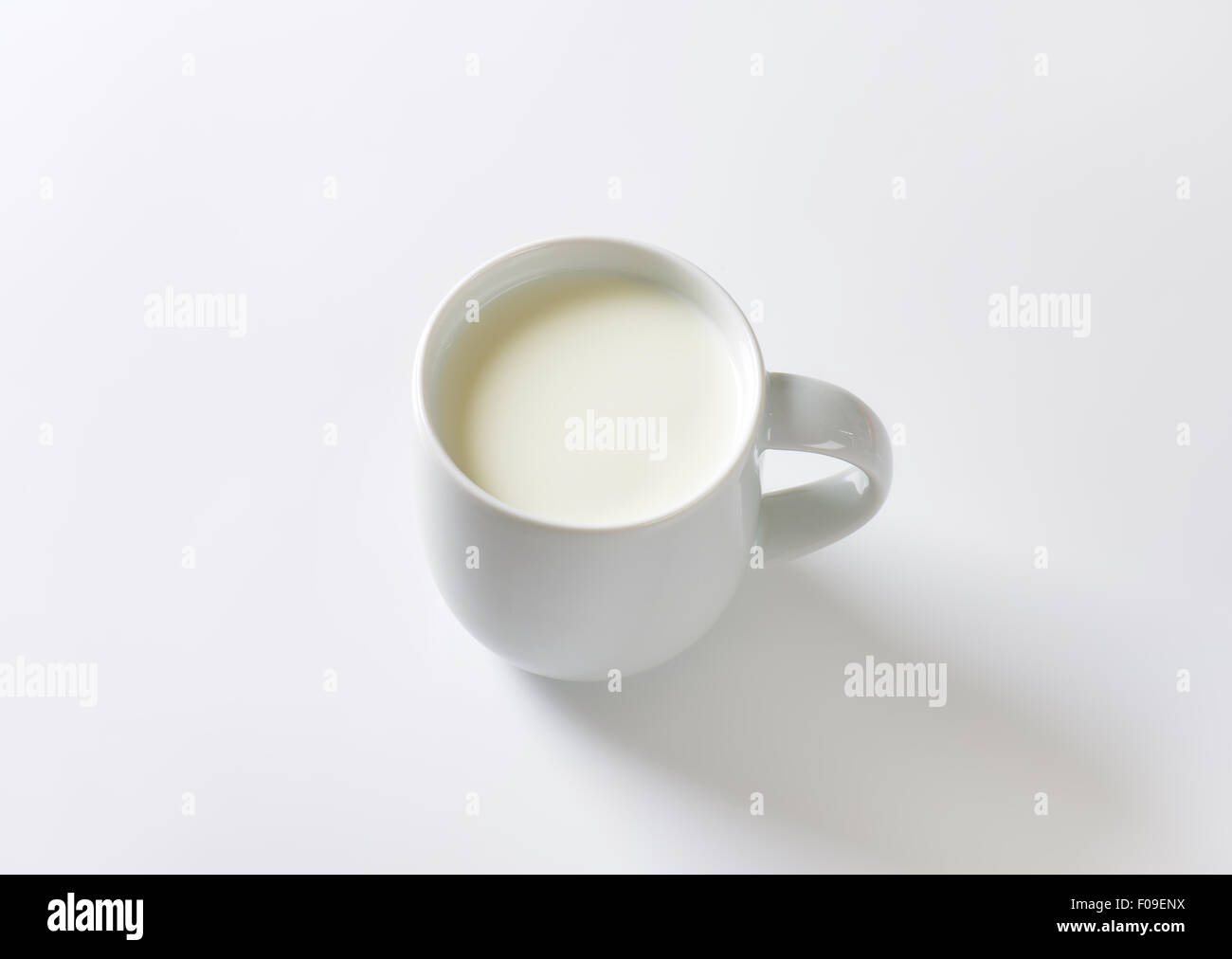 Fresh milk in white mug Stock Photo - Alamy