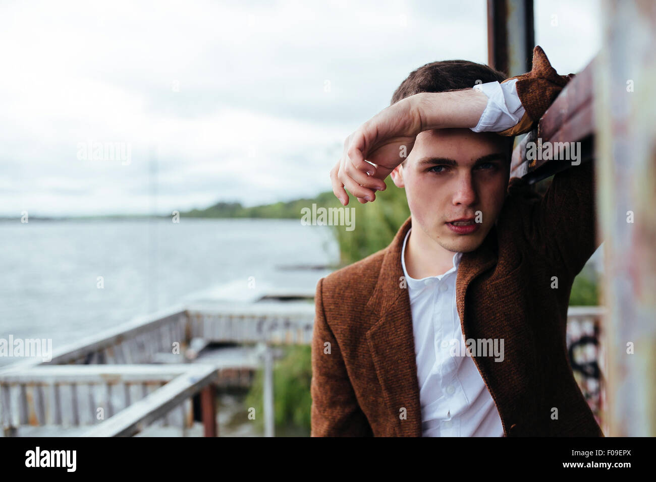 man standing on a pier Stock Photo - Alamy