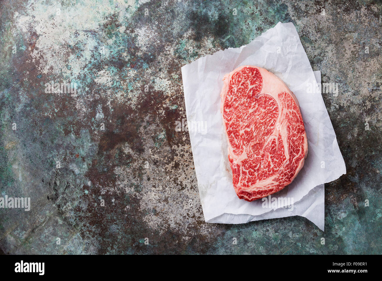 Raw fresh marbled meat Black Angus Steak Ribeye on metal background ...