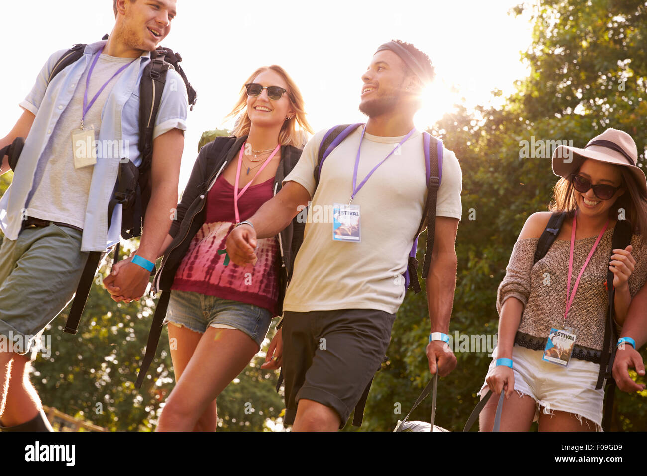 Group Of Young People Going Camping At Music Festival Stock Photo - Alamy