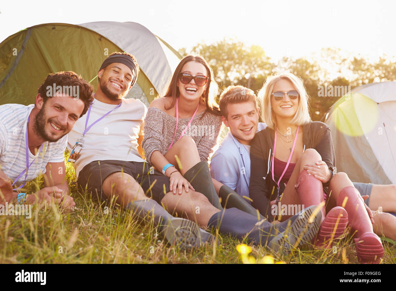 Group Of Friends Relaxing Outside Tents On Camping Holiday Stock Photo ...