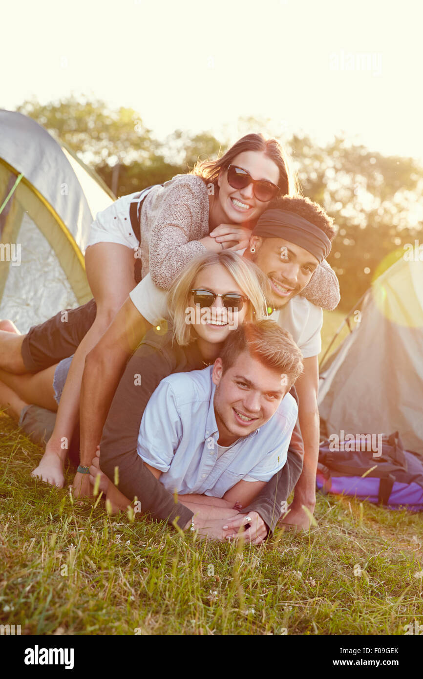 Group Of Friends Having Fun Outside Tents On Camping Holiday Stock ...