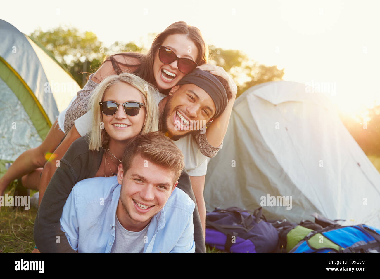 Group Of Friends Having Fun Outside Tents On Camping Holiday Stock ...