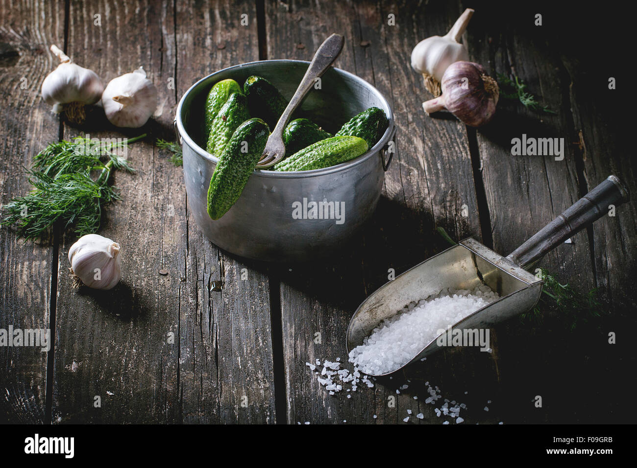 Old aluminum pan with fresh low-salt pickled cucumbers with vintage ...