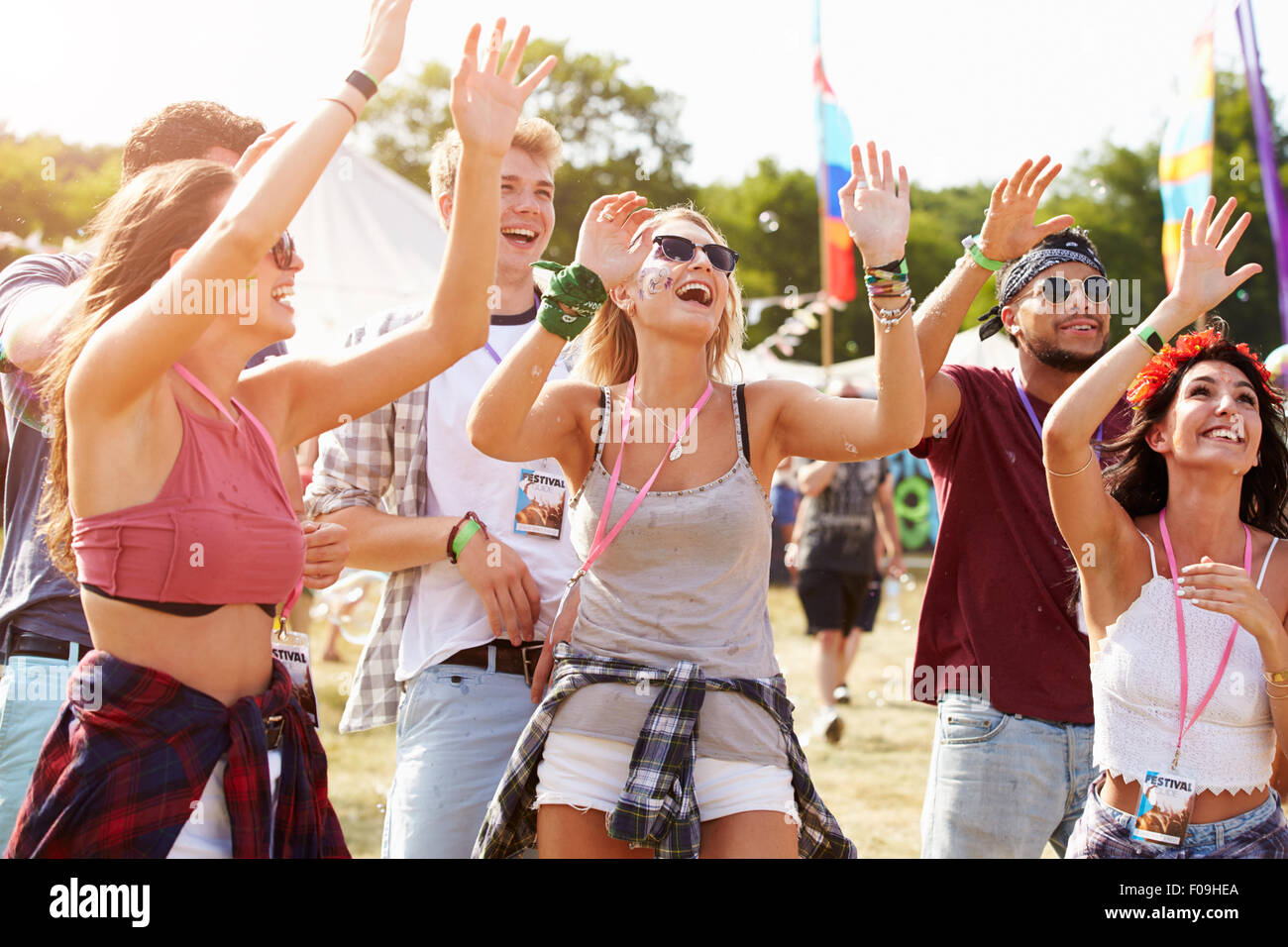 Friends cheering a performance at a music festival Stock Photo - Alamy