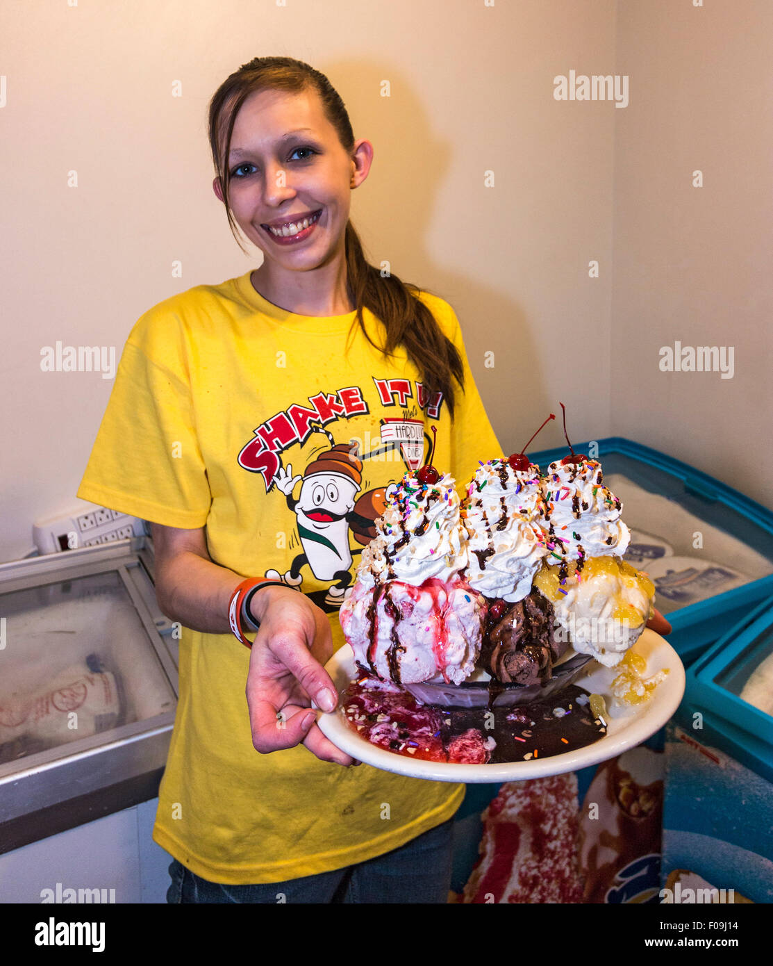 Woman server carries one of the famous HUGE ice cream sundaes at Mel's ...