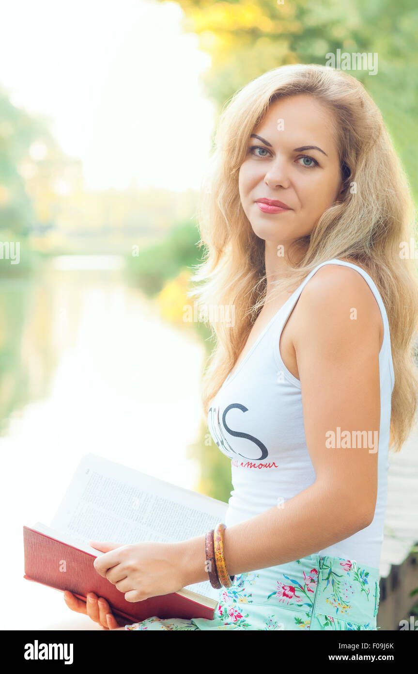Girl with a book Stock Photo - Alamy