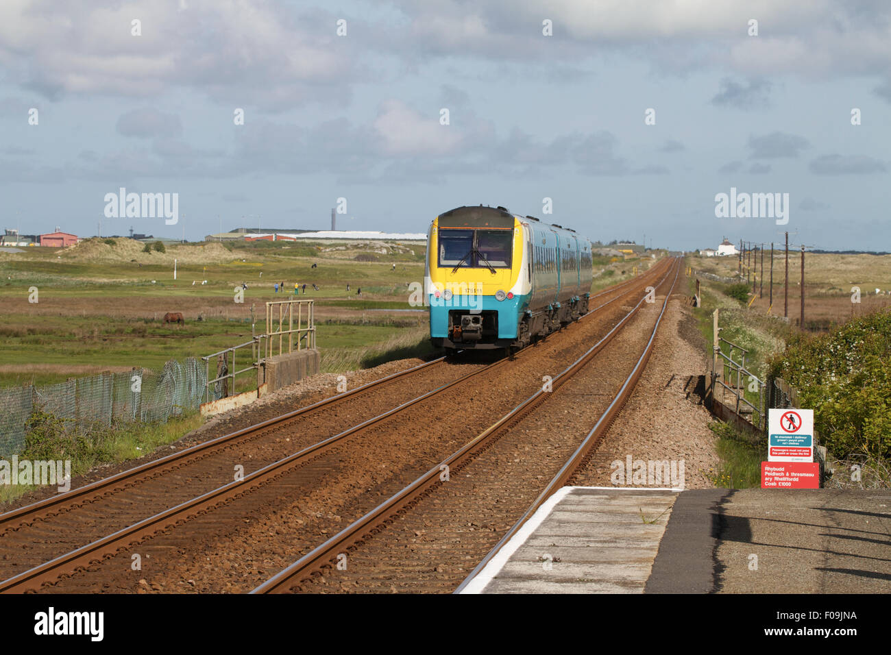 Train approaching Rhosneigr Station. Anglesey, Wales Stock Photo - Alamy