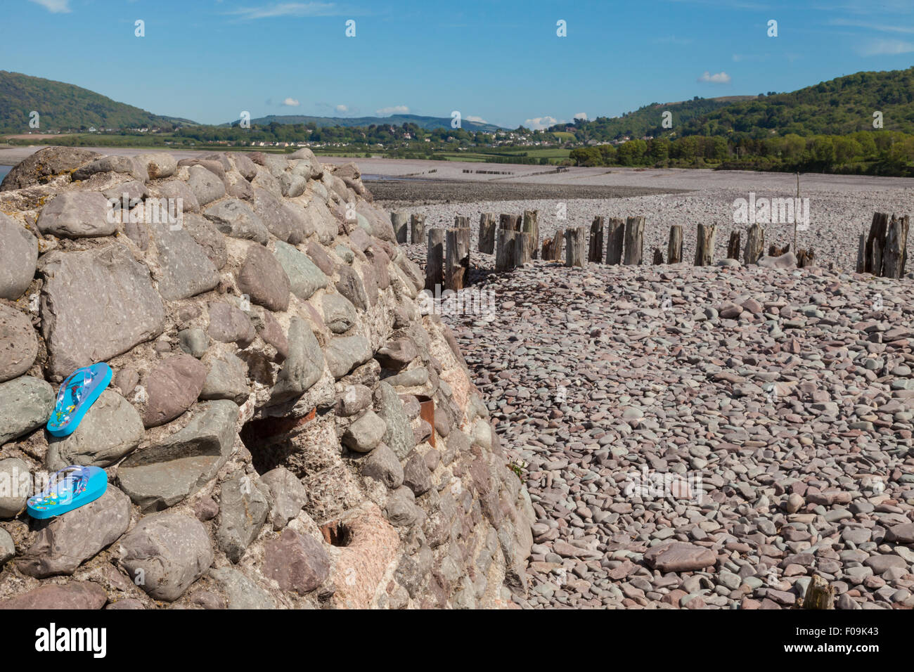 World War Two Pill Box concrete bunker with lost colorful beach sandals ...