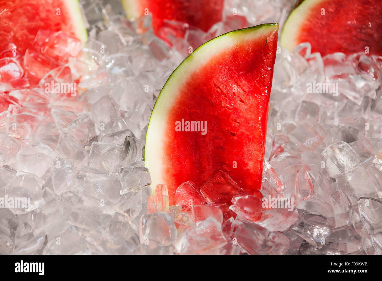 Parts of watermelon on ice on farmer market Stock Photo - Alamy