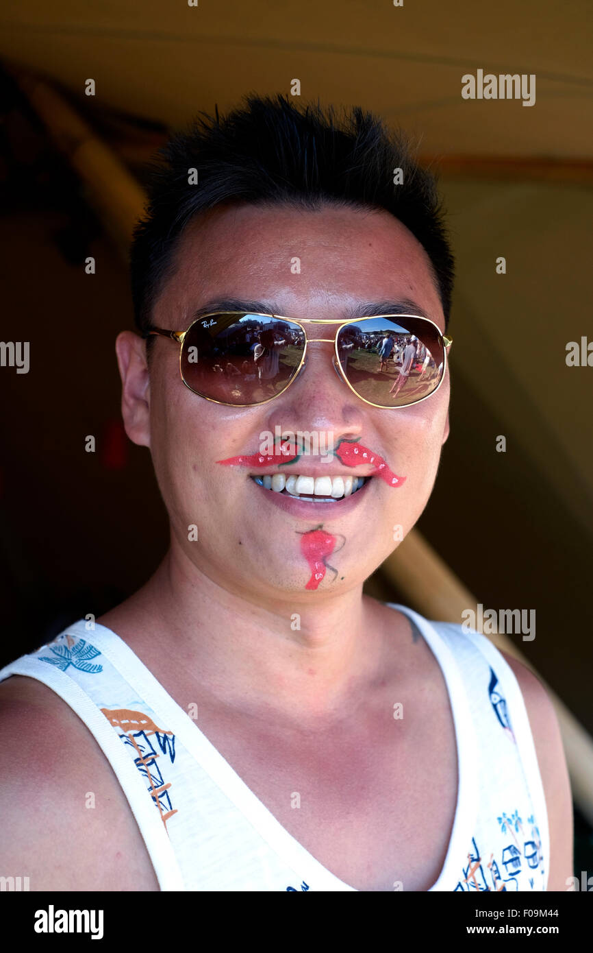 young male with face painted at the chilli fiesta festival at west dean ...