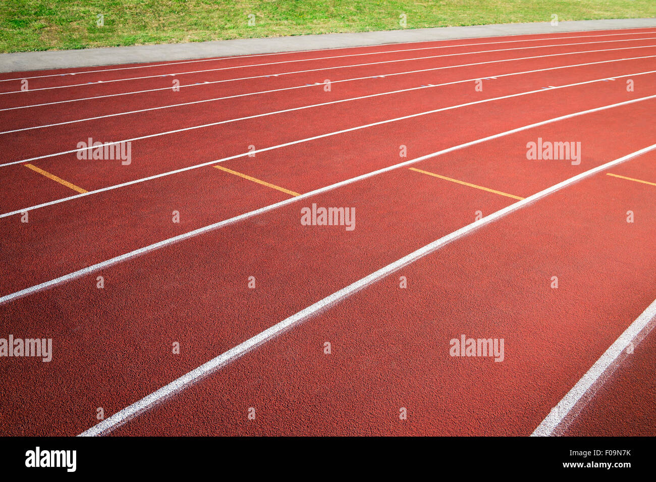 Athletic running track in modern red rubber close-up abstract ...