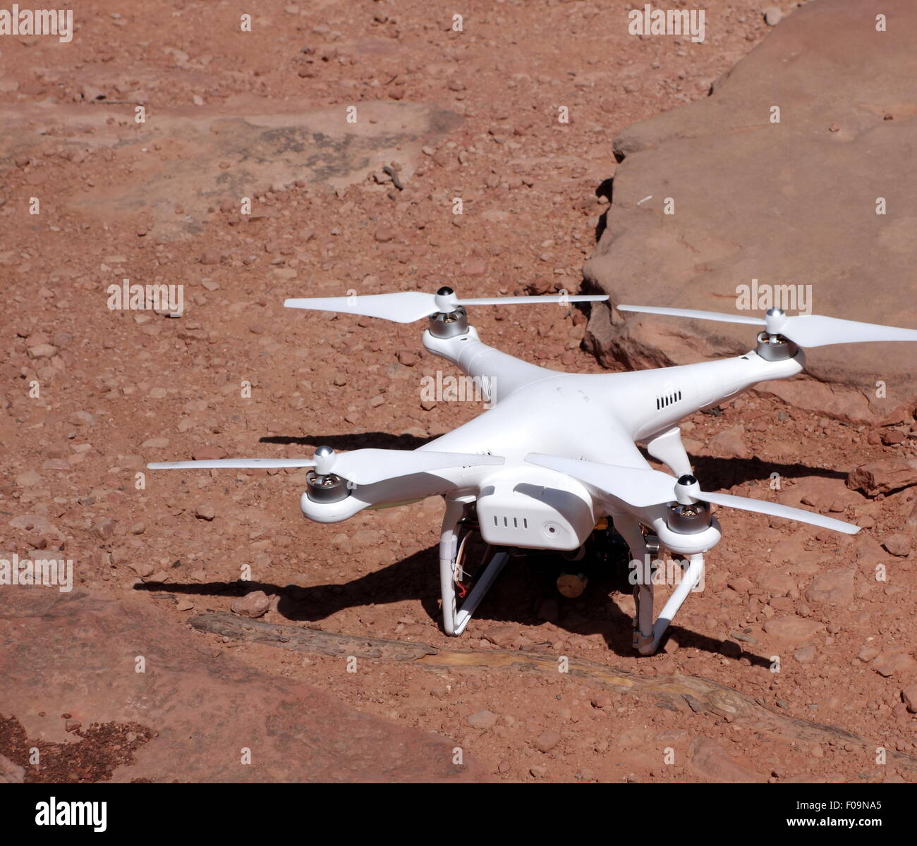 White drone on red rock mountain Stock Photo - Alamy