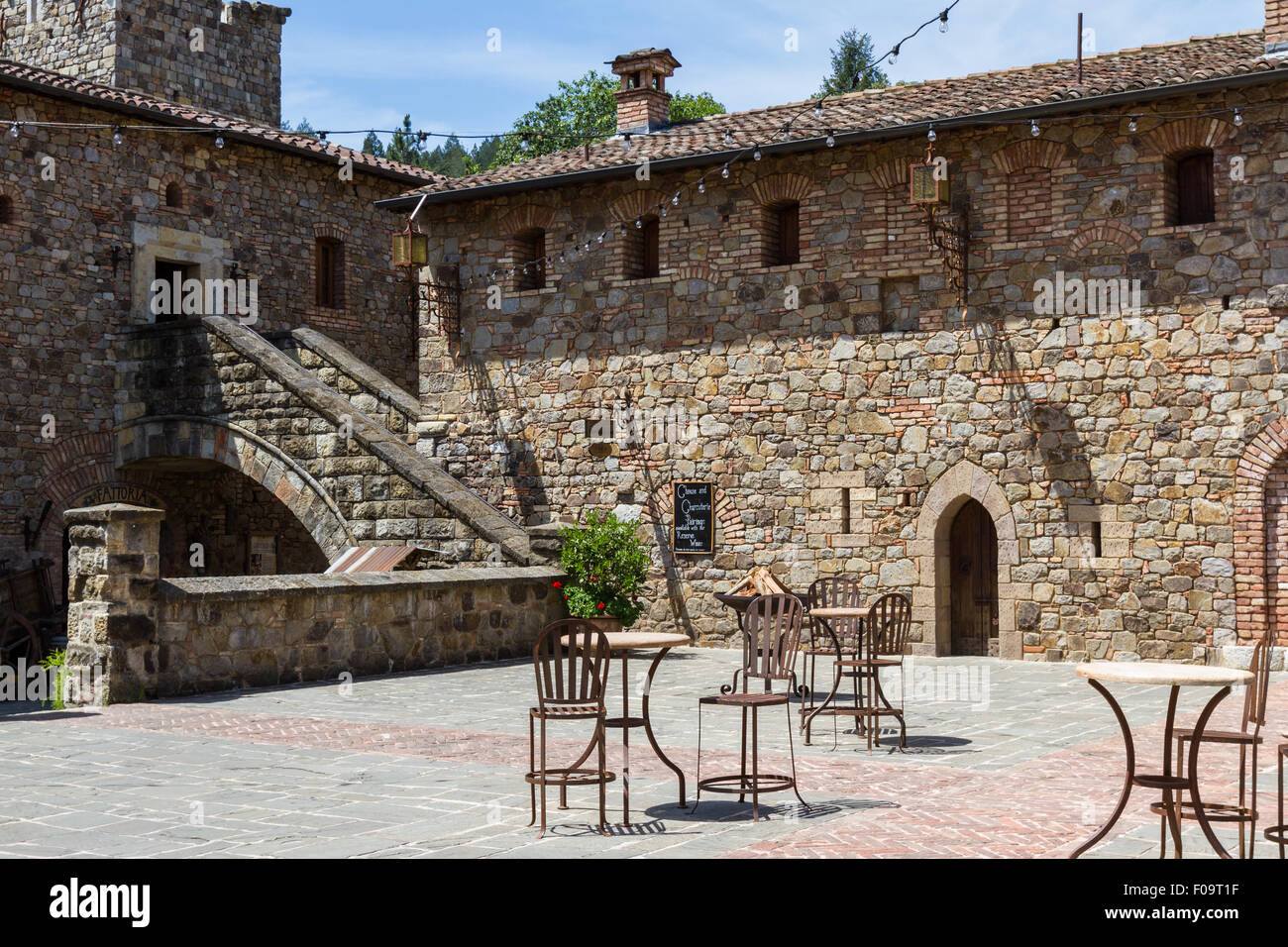 view of a courtyard inside of a stone castle bolt in California Stock ...