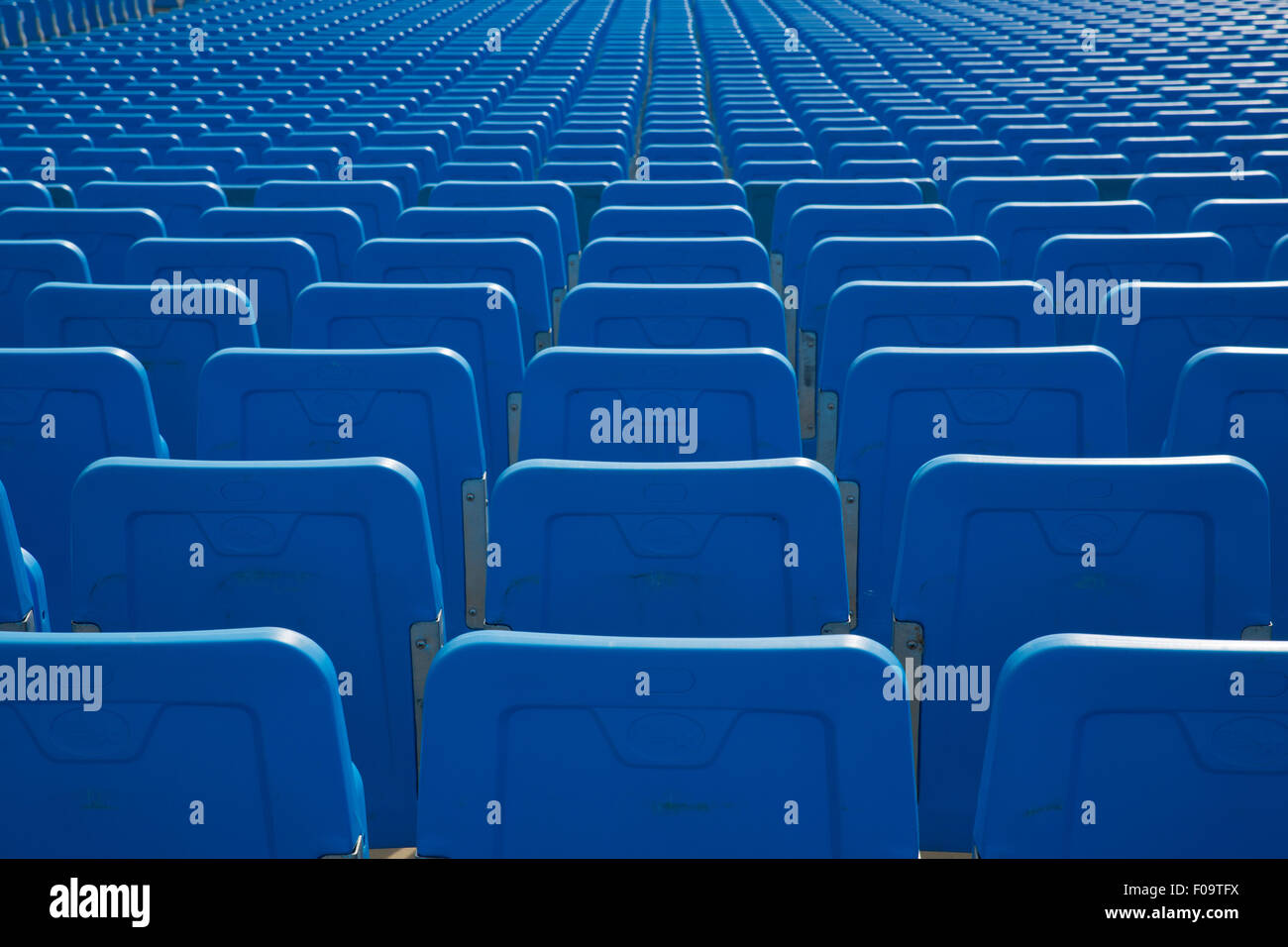 Rows of blue concert chairs Stock Photo - Alamy
