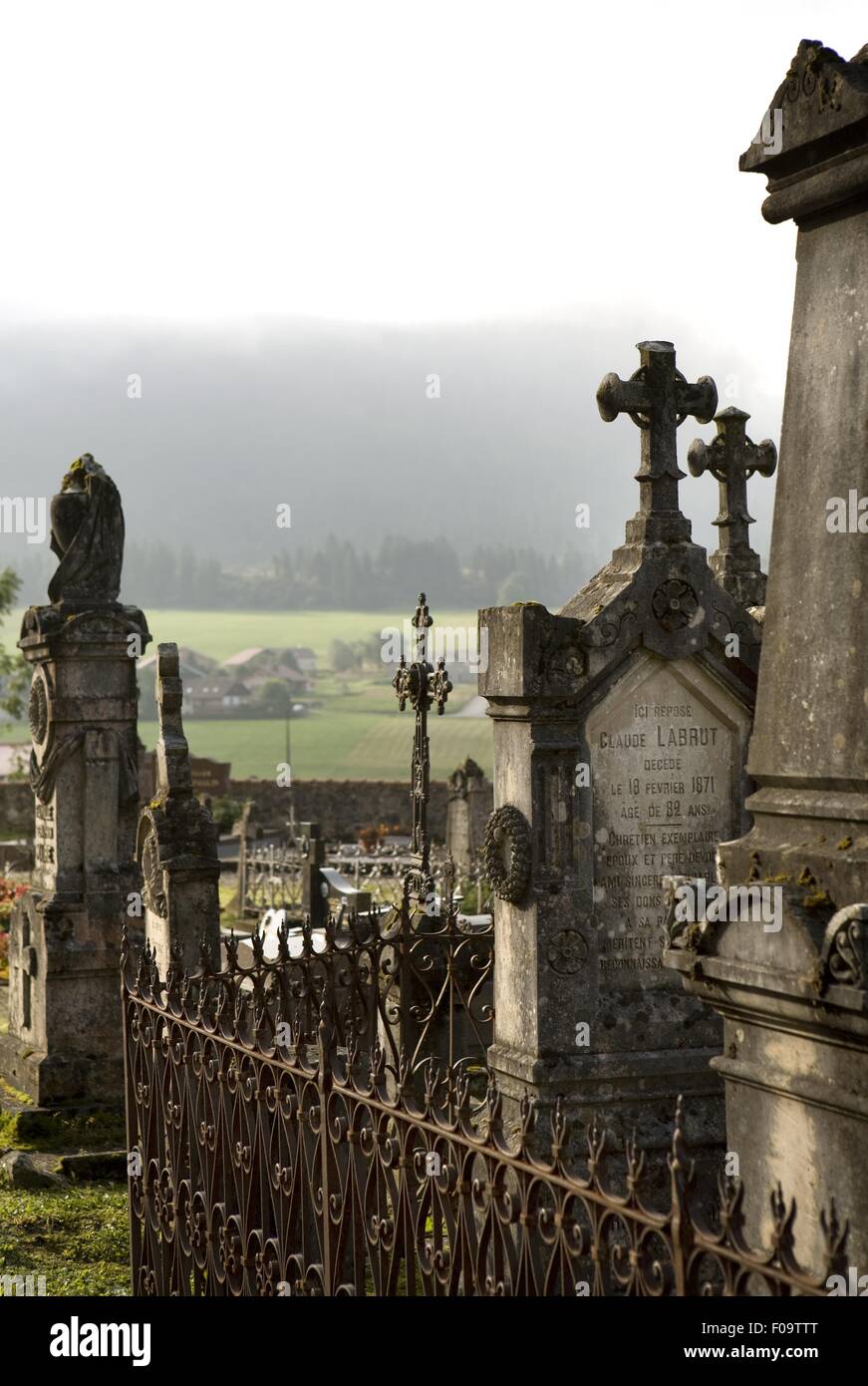 Grave stone and cross in cemetery, France Stock Photo - Alamy