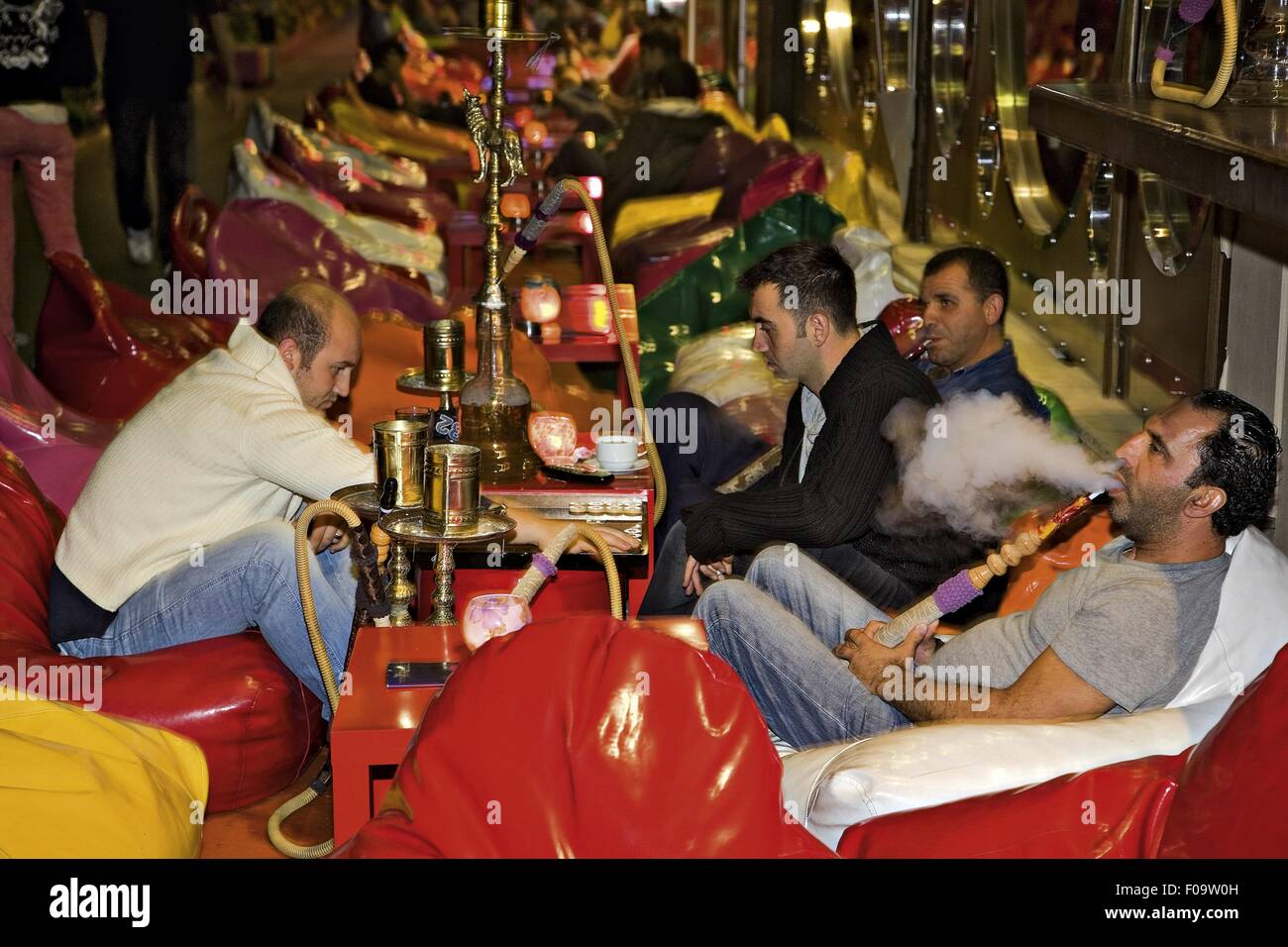People sitting in pub and smoking huka, Pera Golden Horn Istiklal ...