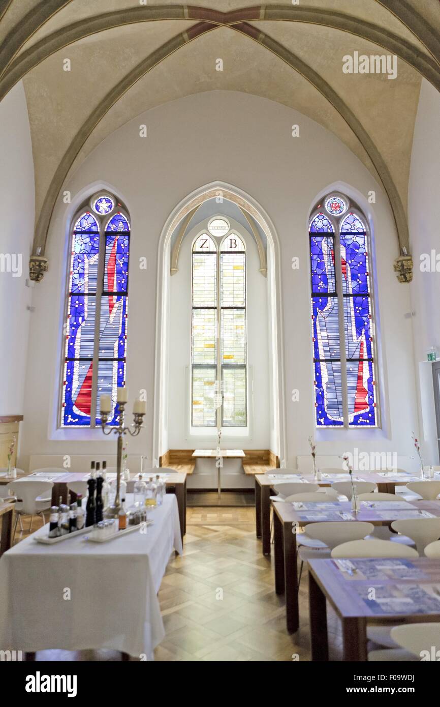 Dining room of Hopper Hotel St. Josef with colourful church window in ...