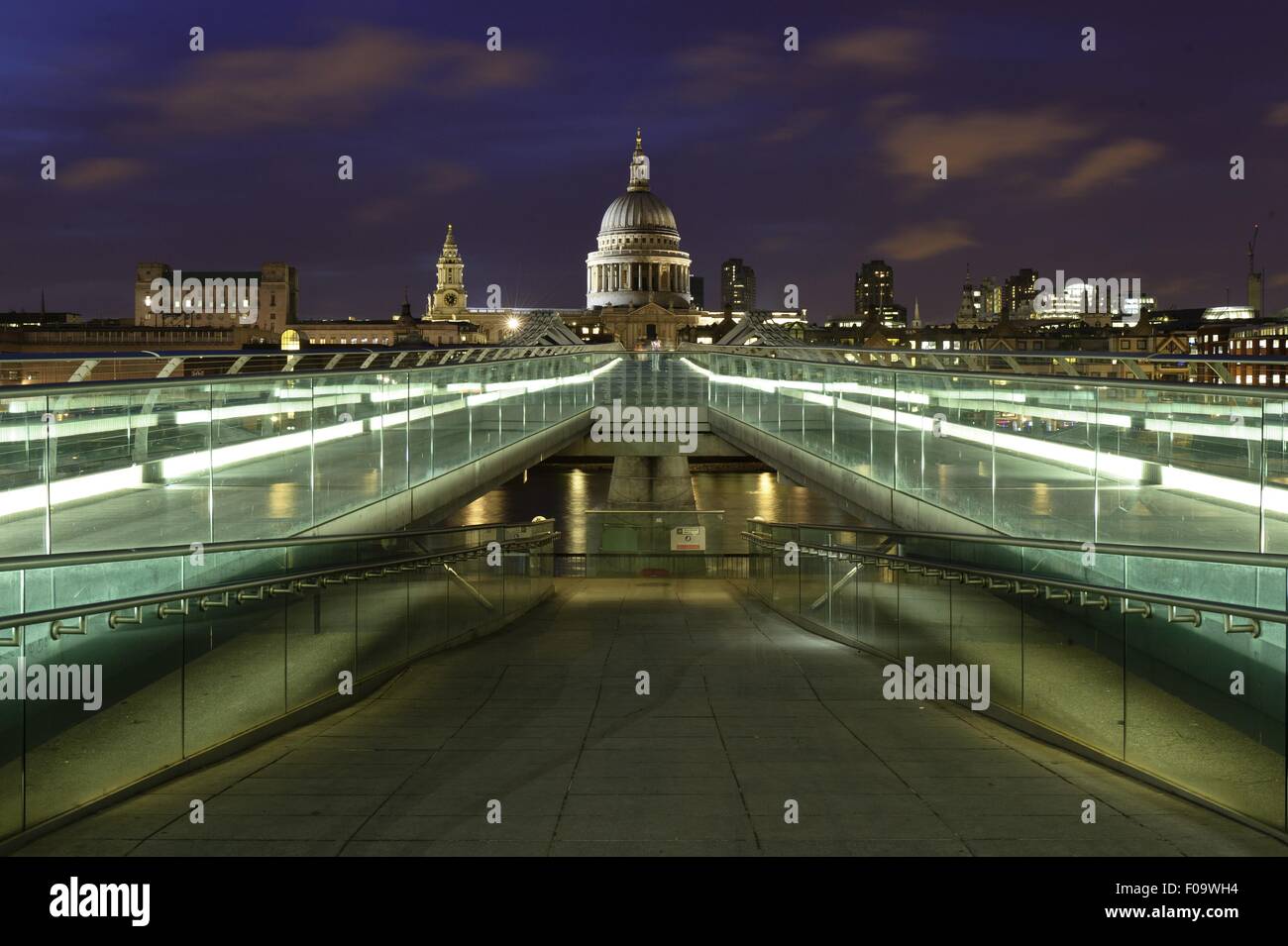 View of Millennium Bridge, Tate Modern and St Paul's Cathedral at dusk ...