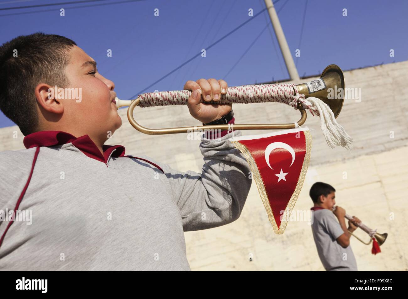 Boy blowing bugle at Avanos school, Cappadocia Anatolia, Turkey Stock ...