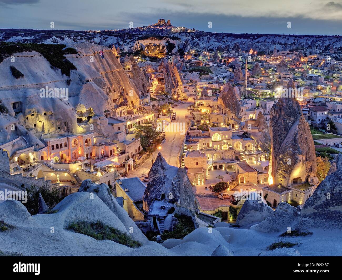 Elevated view of illuminated Goreme Anatolian rock village, Cappadocia ...