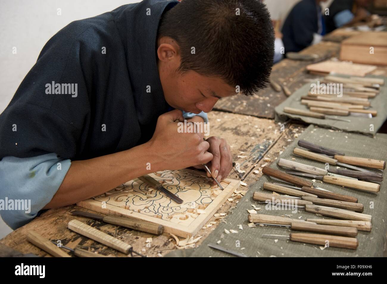 Man carving on wood with carving knife hi-res stock photography and ...