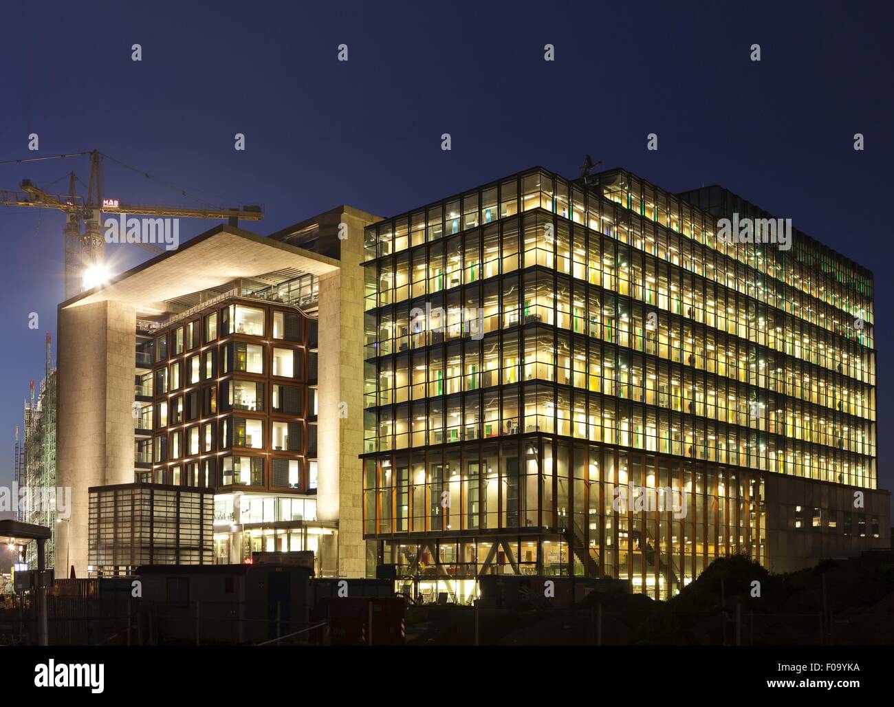 View of illuminated public library and music conservatory in Amsterdam ...