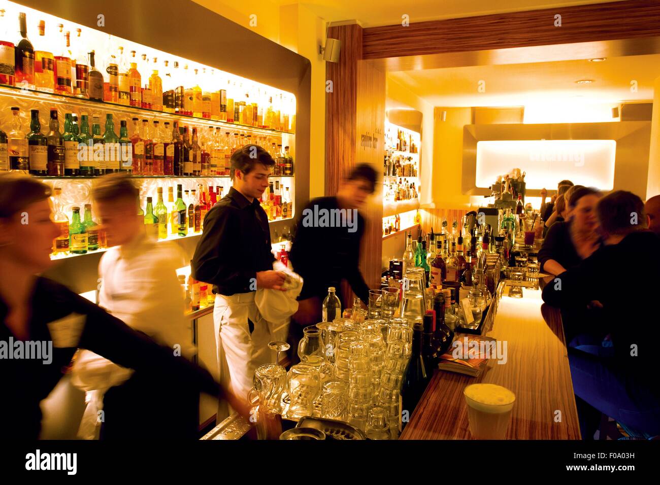 Bartender working at bar counter in Sapphires, Berlin, Germany Stock ...
