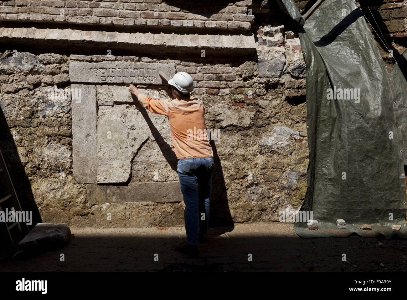 Man working at Archaeological Zone of Jewish Museum, Cologne, Germany ...