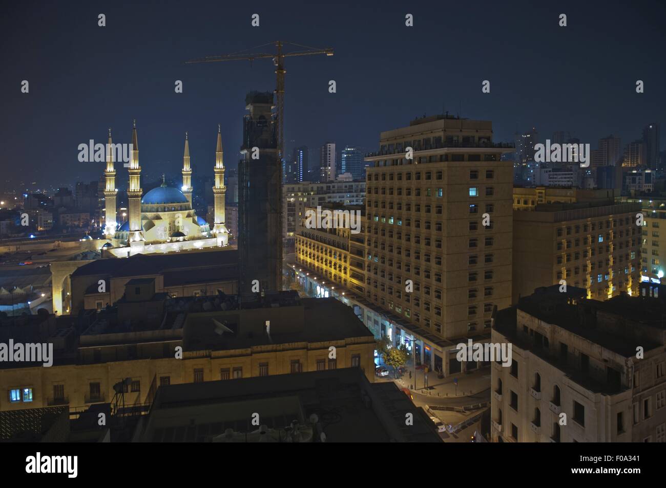 View of illuminated Mohammad Al-Amin Mosque at night in Martyrs' Square ...