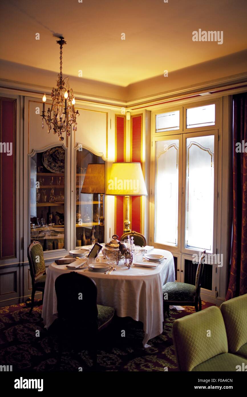 Interior of restaurant with dining table and illuminated lamp Stock ...