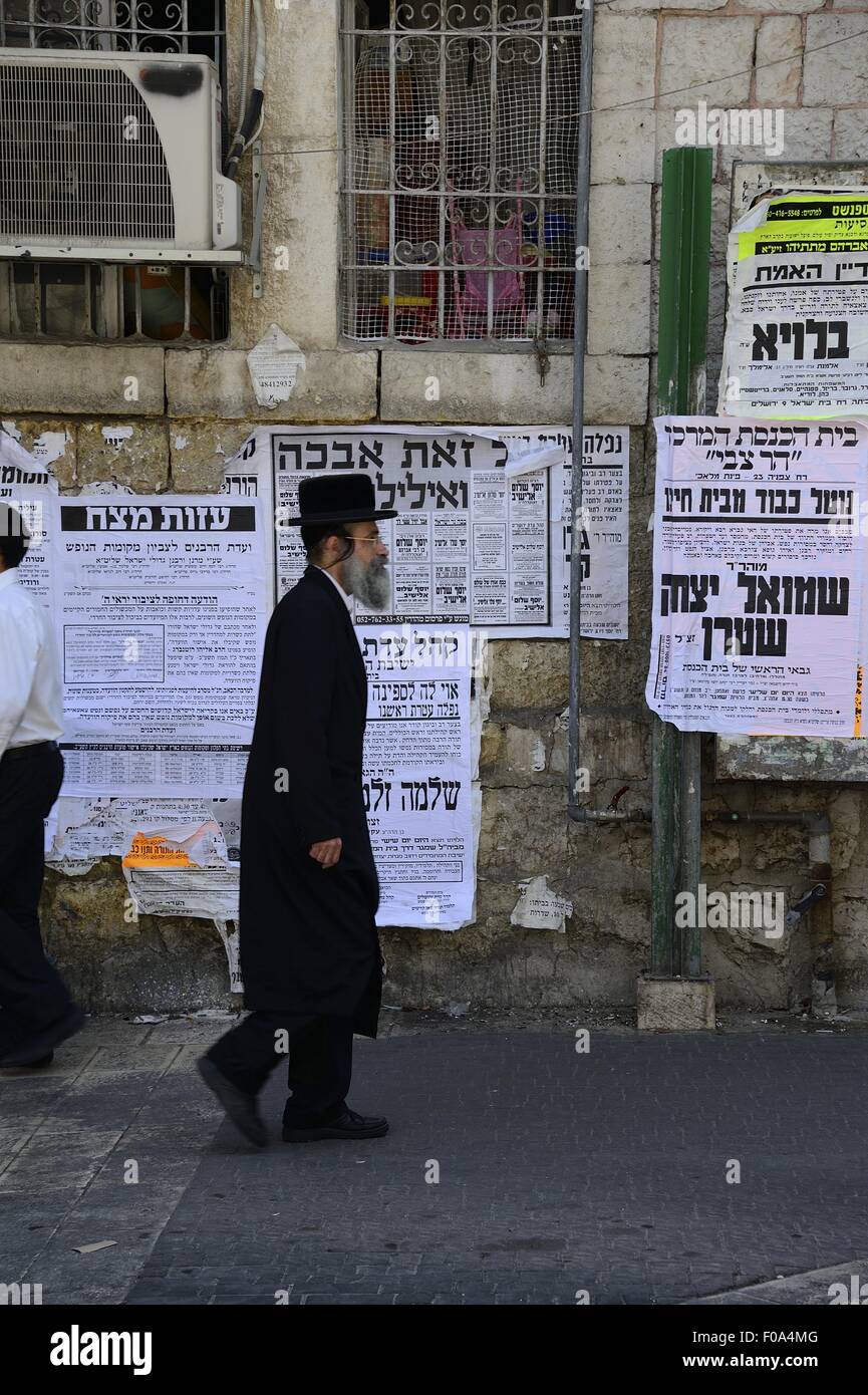 Side view of Haredi man walking on street at Mea Shearim, Jerusalem ...