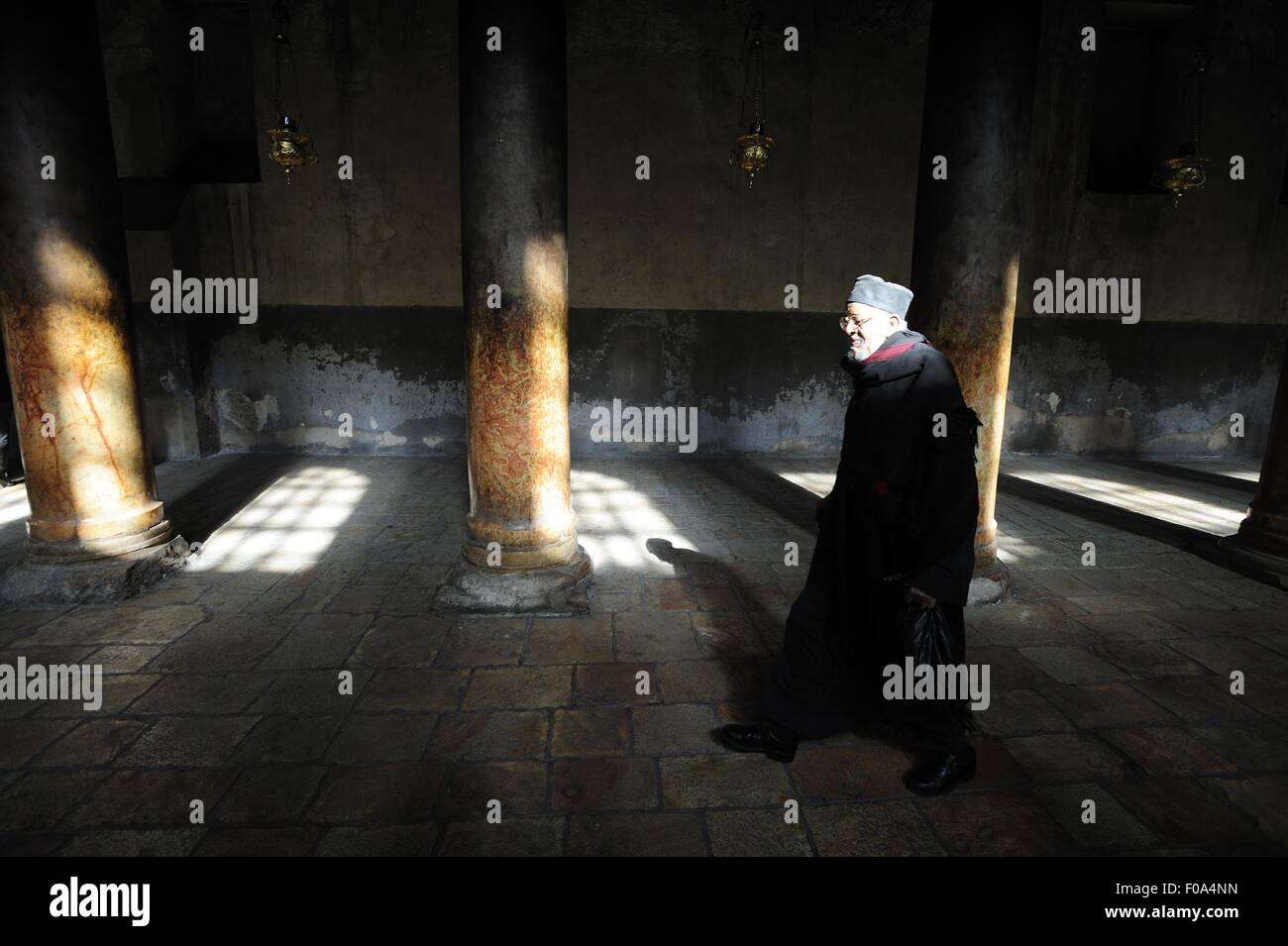 Jewish man standing in front of column in Church of Nativity, Bethlehem ...