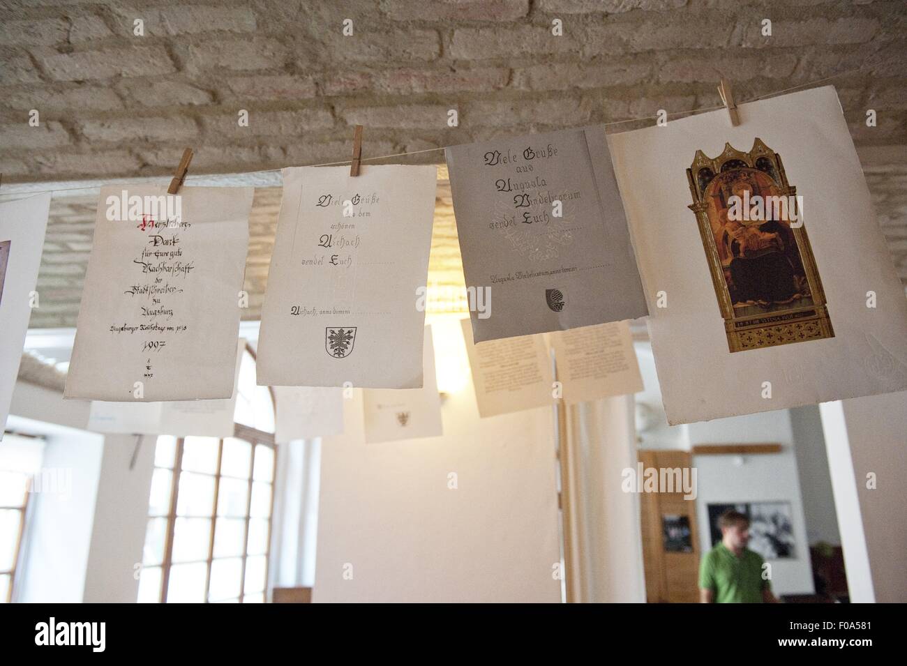 Room with post cards hanging on rope Stock Photo - Alamy