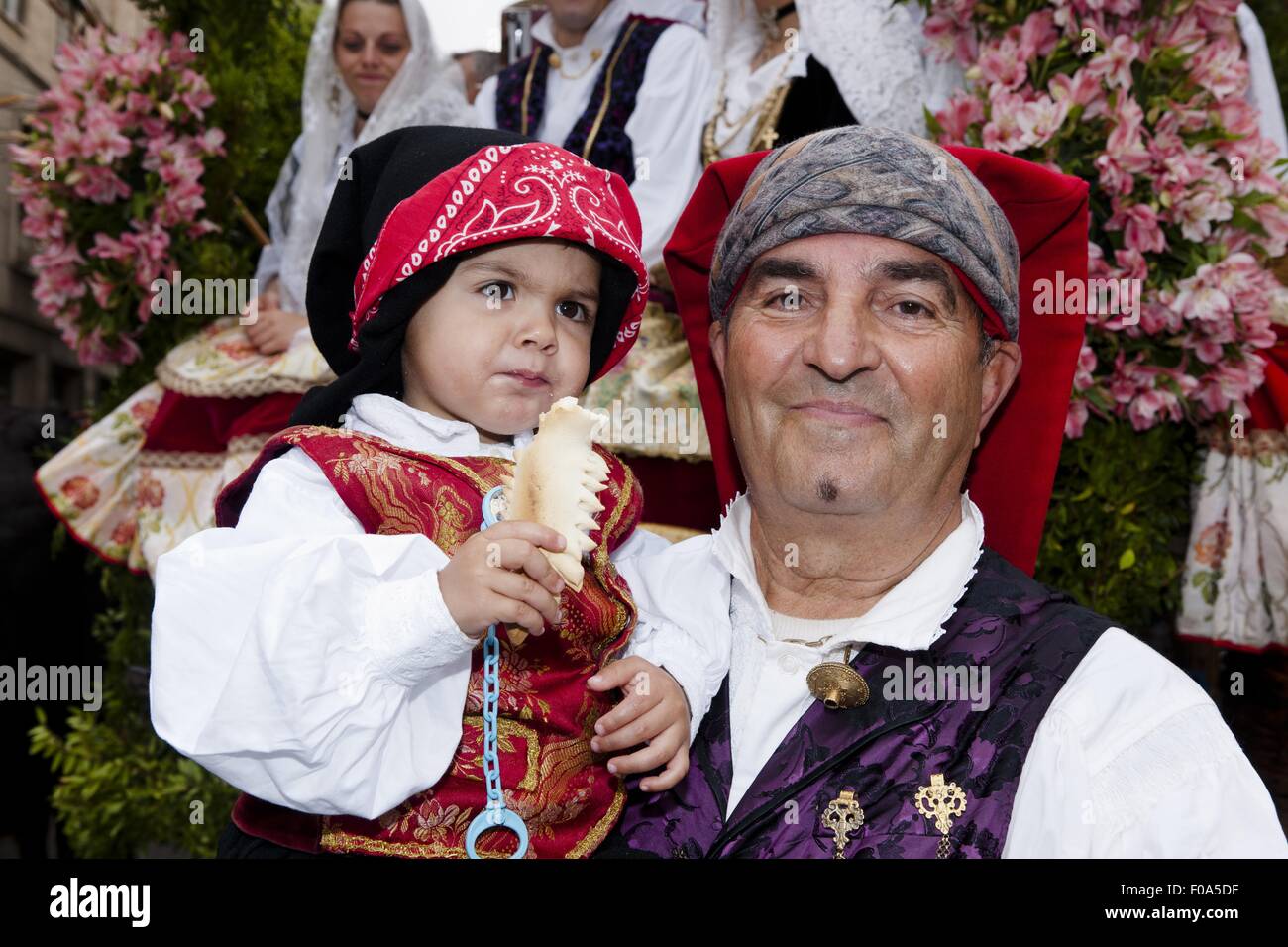 Man smiling with child, Sardinia, Italy Stock Photo - Alamy