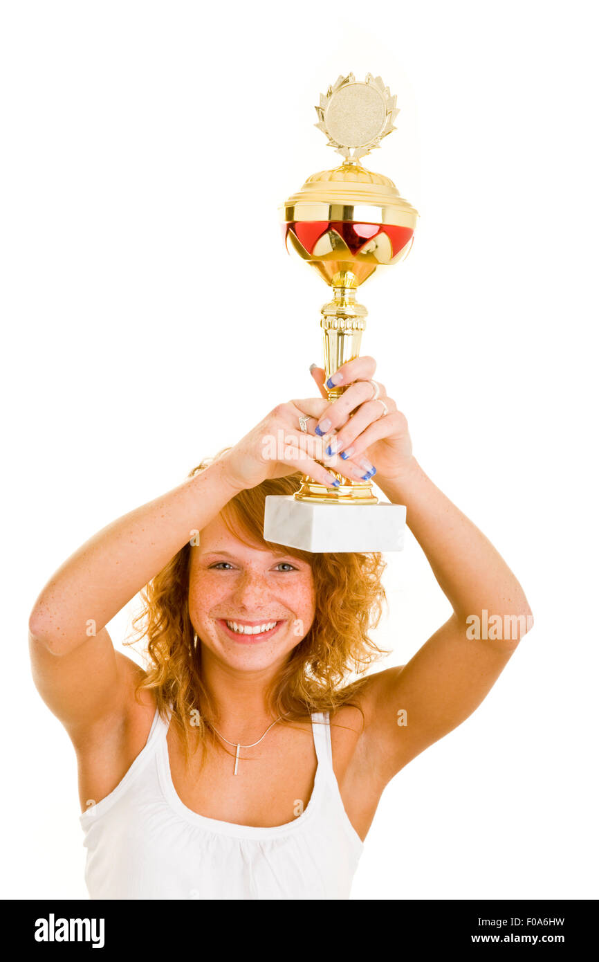 Young happy woman holding a trophy over her head Stock Photo - Alamy