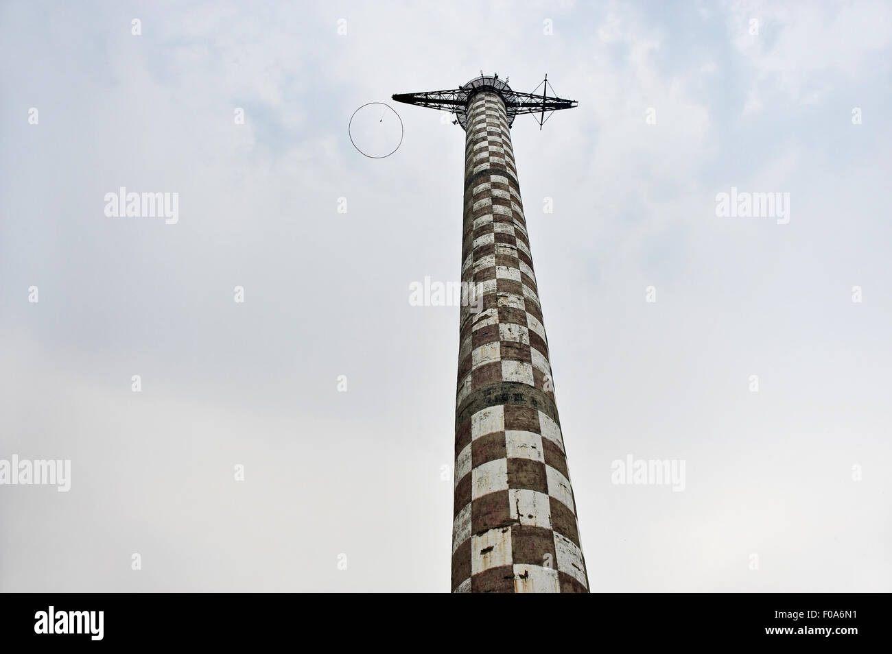 Industrial view with an abandoned parachute jump tower Stock Photo - Alamy