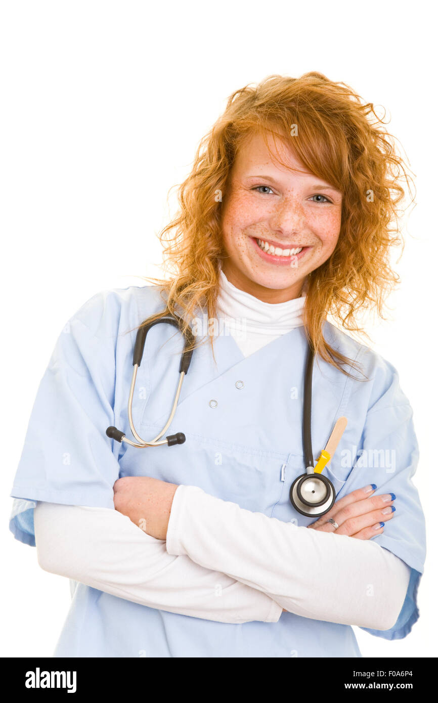 Smiling young nurse in lab coat with arms crossed Stock Photo - Alamy