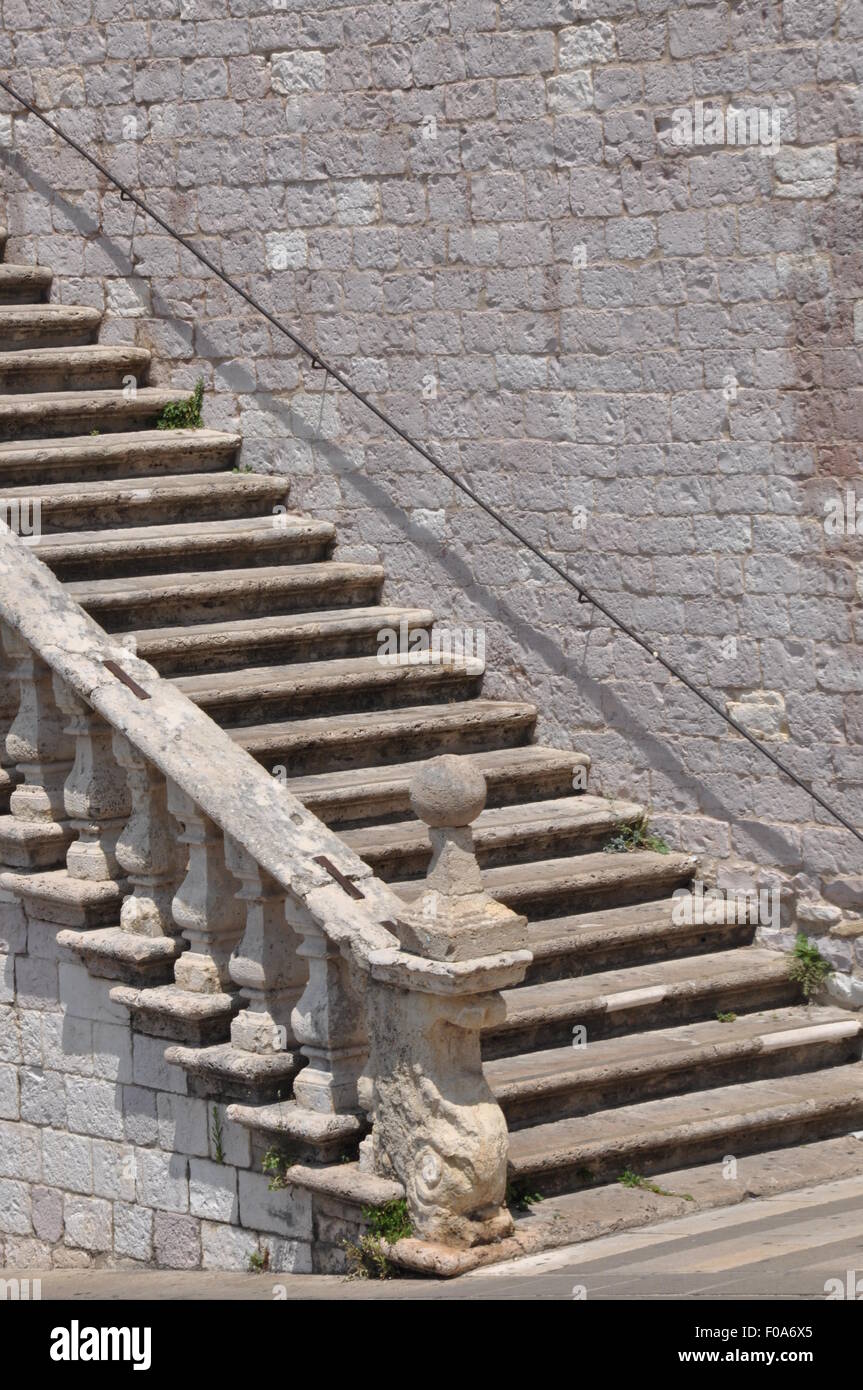 Stone stairs along the high wall Stock Photo - Alamy
