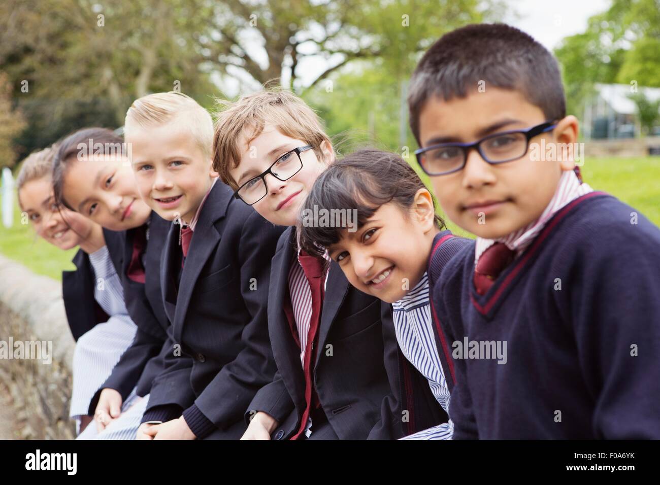 Group of young classmates in playground Stock Photo - Alamy