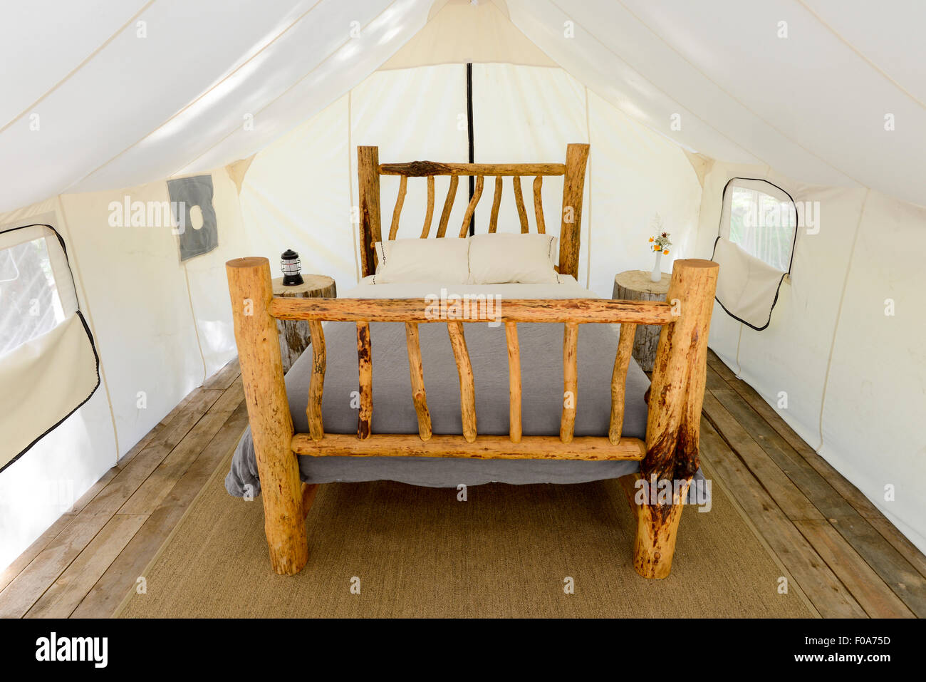 Log bed in a wall tent at the Minam River Lodge in Oregon's Wallowa ...