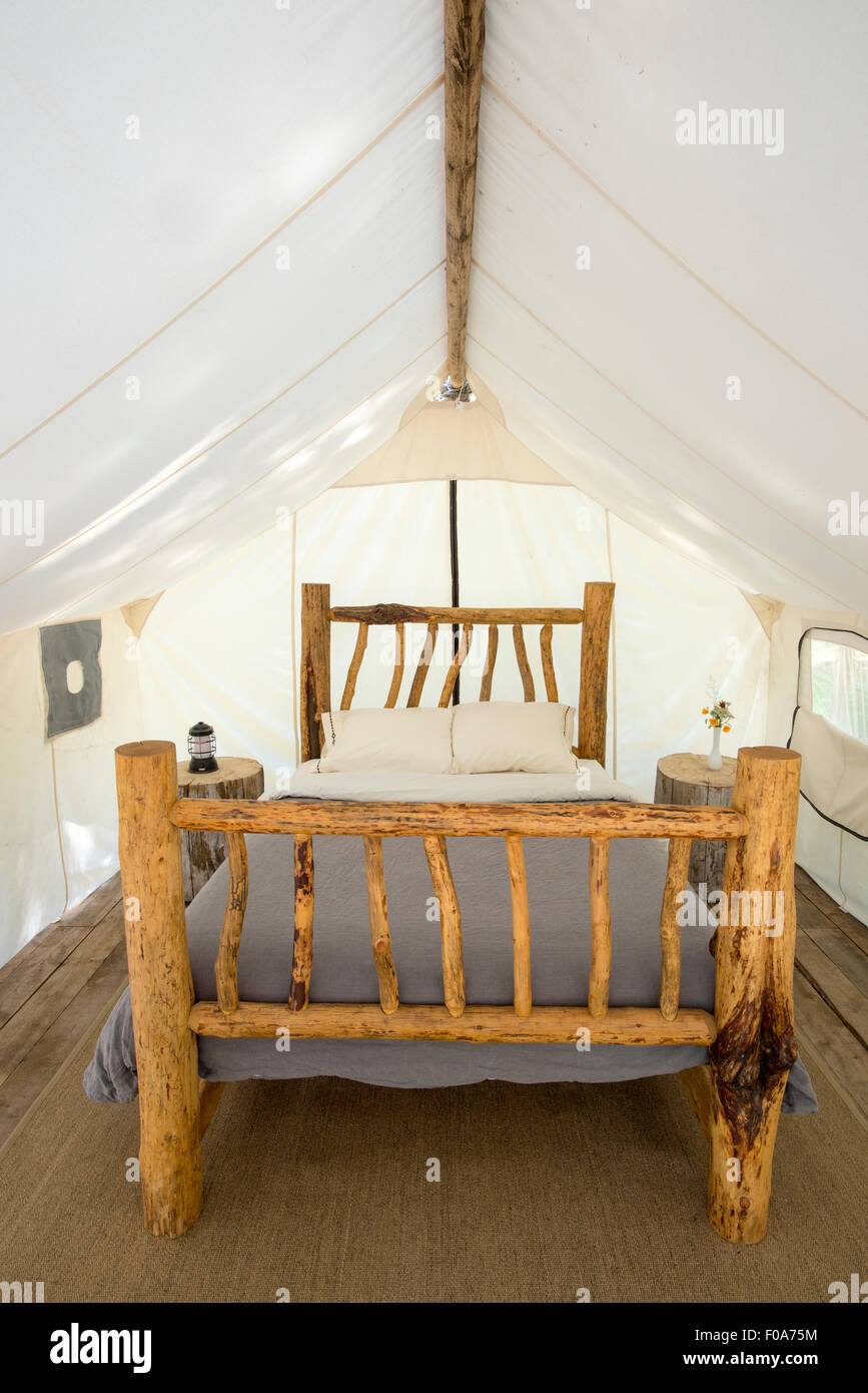 Log bed in a wall tent at the Minam River Lodge in Oregon's Wallowa ...