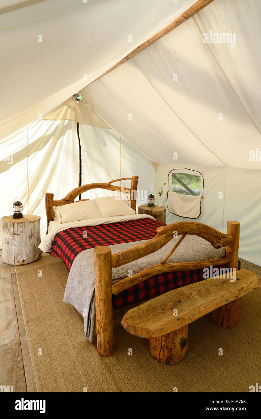 Log bed in a wall tent at the Minam River Lodge in Oregon's Wallowa ...