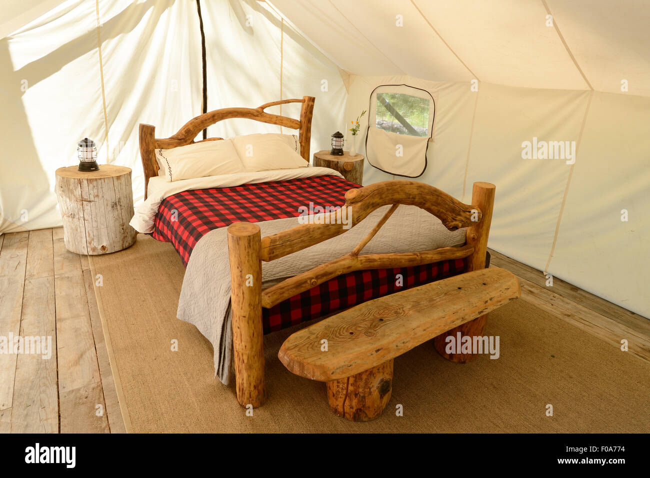 Log bed in a wall tent at the Minam River Lodge in Oregon's Wallowa ...