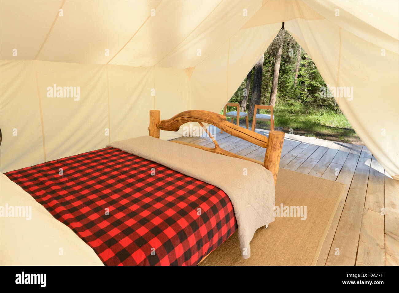 Log bed in a wall tent at the Minam River Lodge in Oregon's Wallowa ...