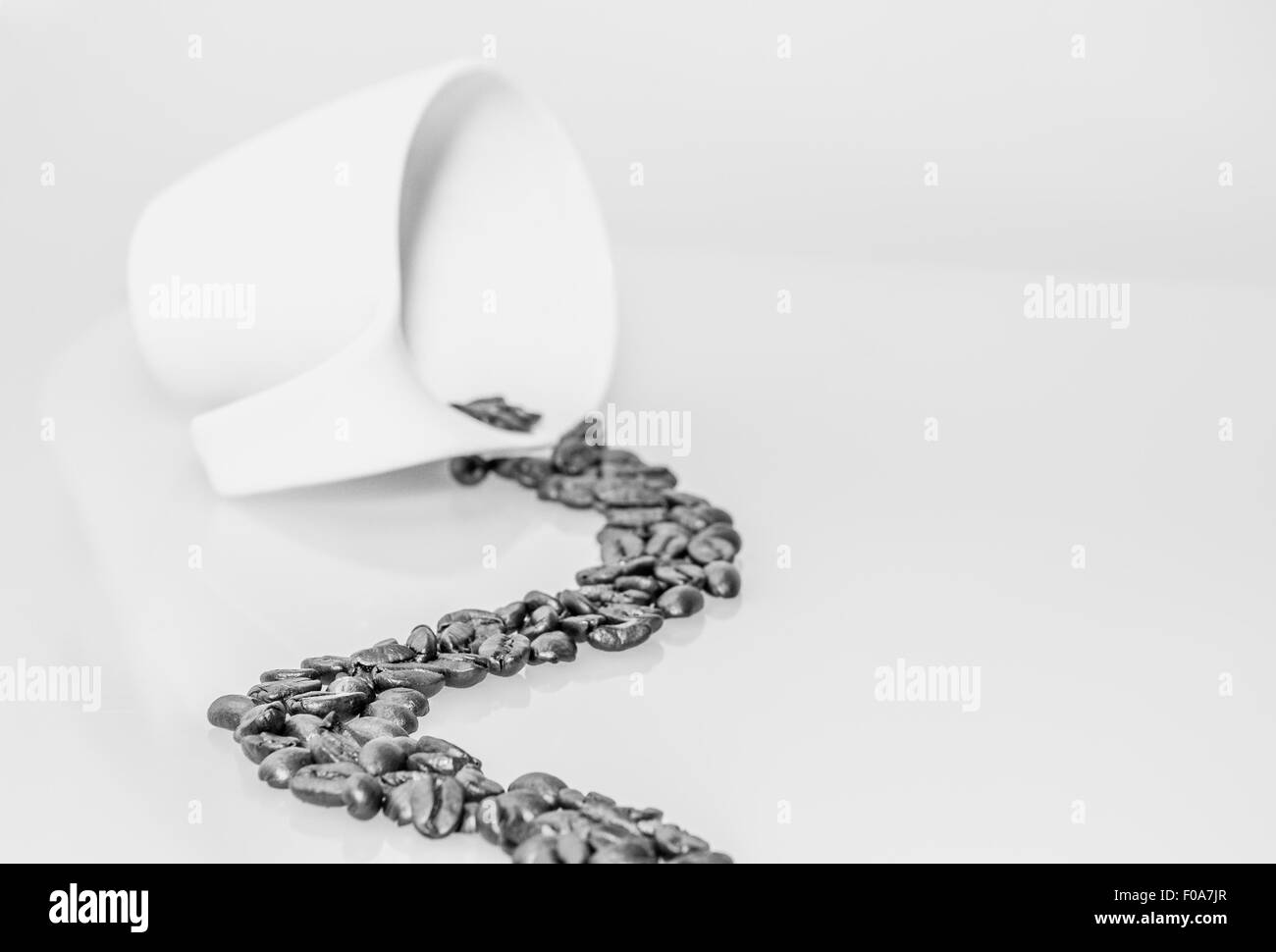 Coffee beans path that goes into the coffee cup Stock Photo - Alamy